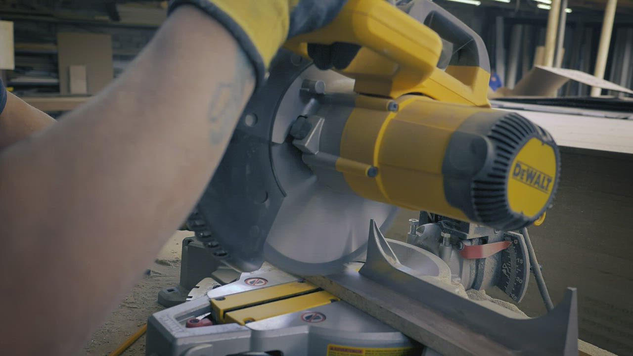 Man in a carpentry cutting with an electric saw - Free Stock Video