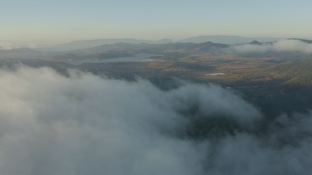 Landscape seen from above covered by mist - Free Stock Video