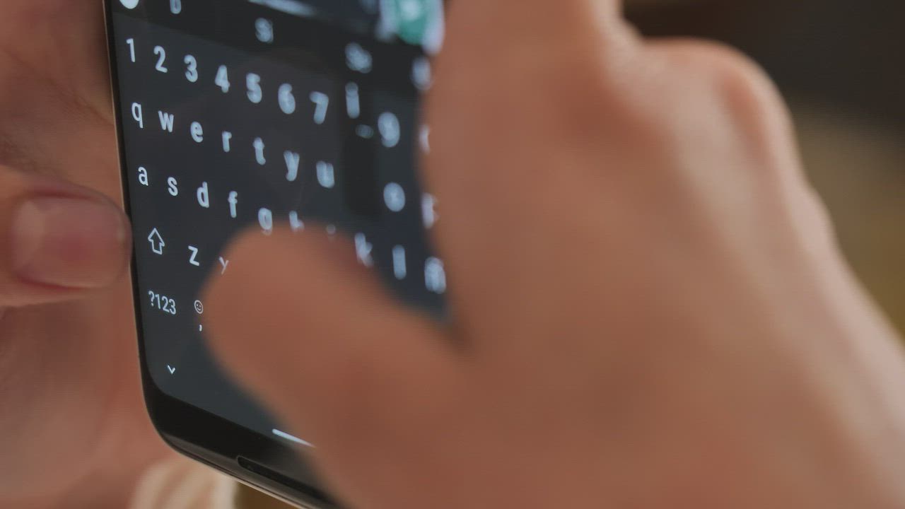 Hands of a Young Woman Typing on Her Smartphone - Free Stock Video