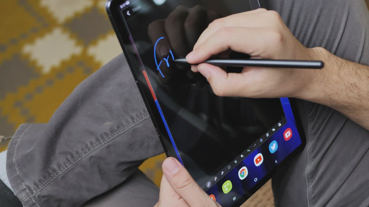 Man drawing on a tablet and with a touch pen - Free Stock Video
