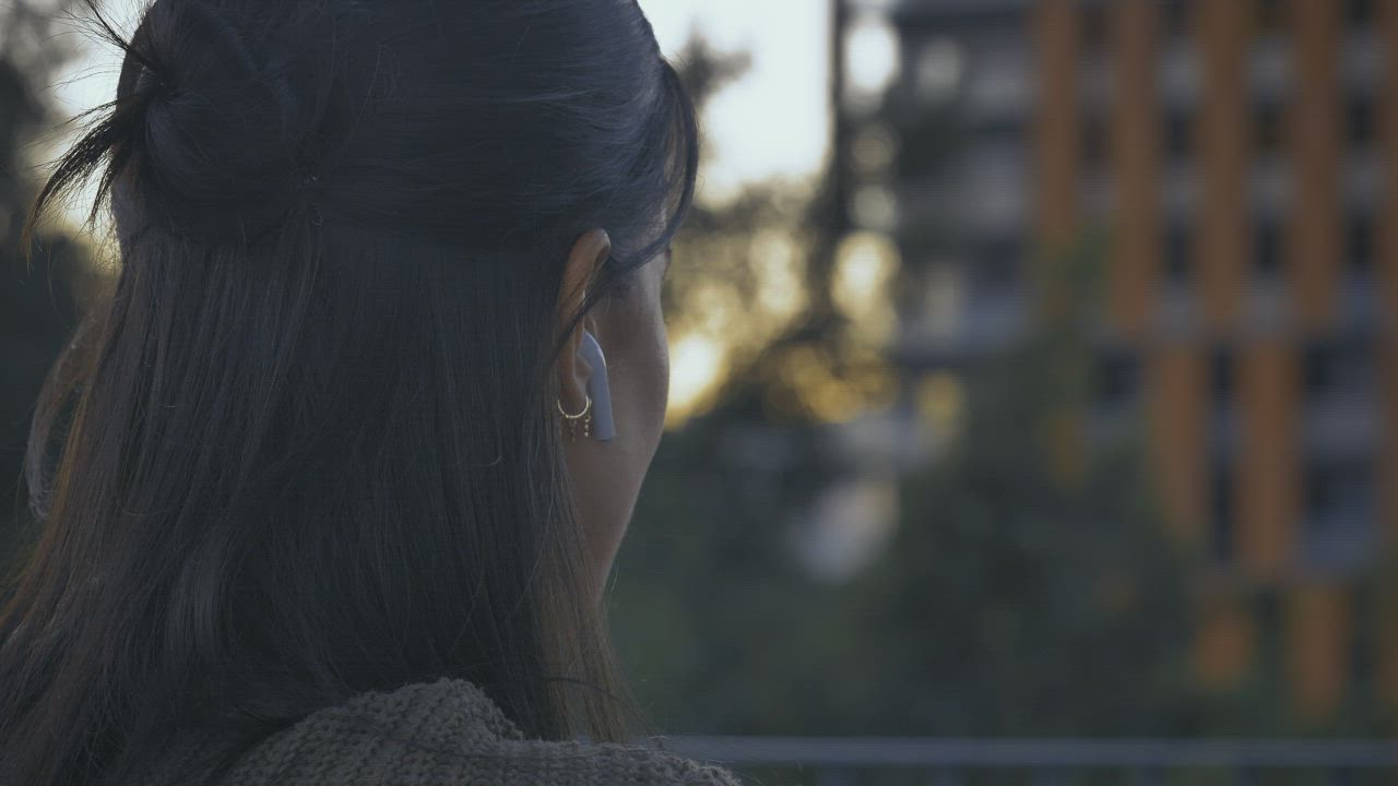 Woman outdoors taking a phone call - Free Stock Video