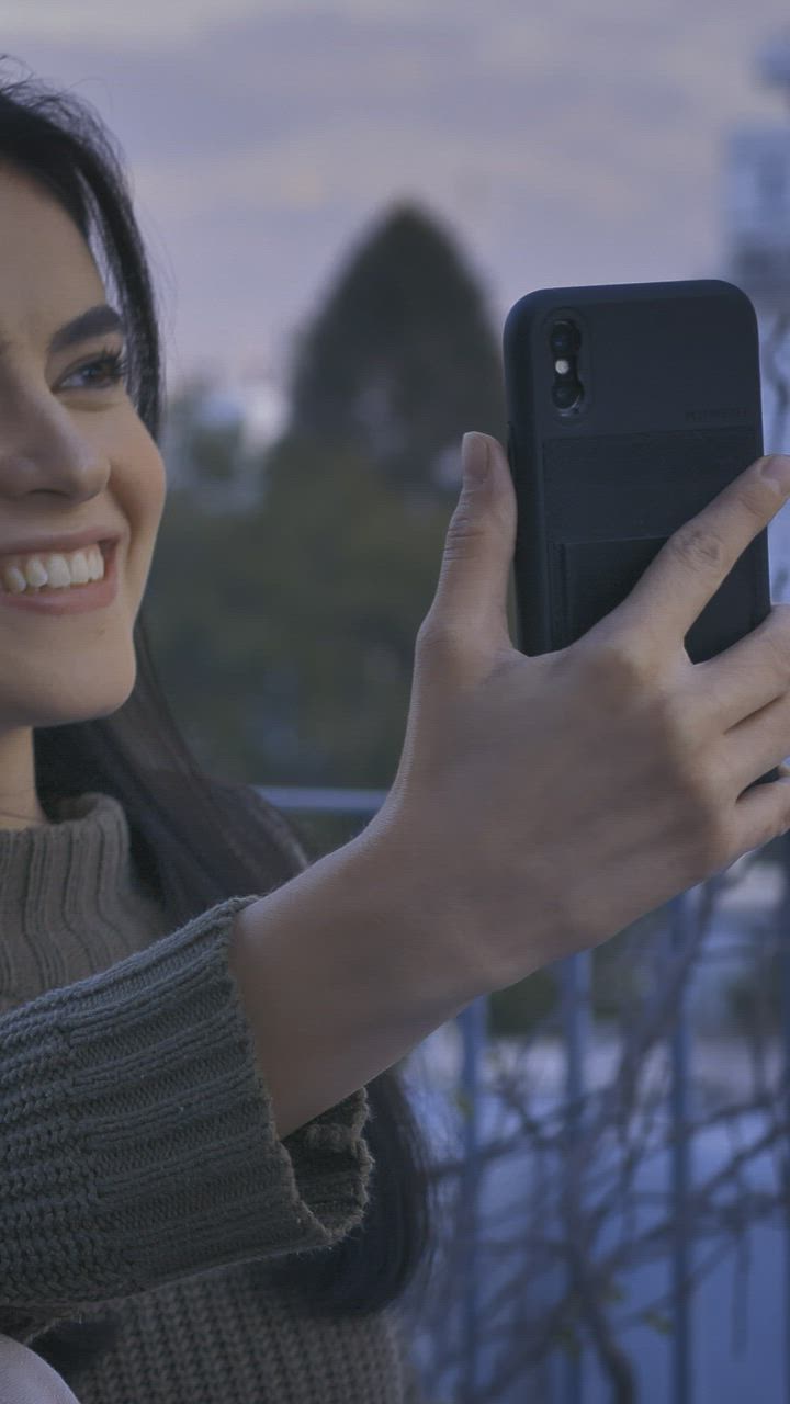 Laughing girl talking on a video call - Free Stock Video