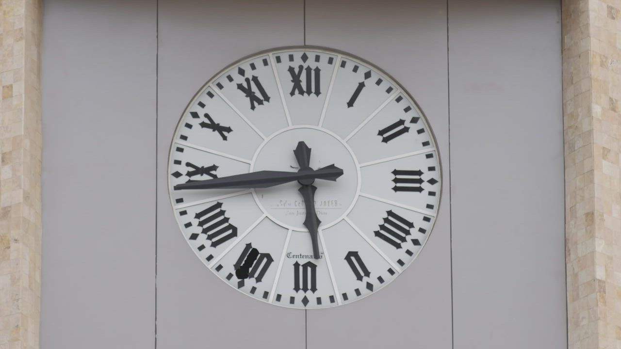 Roman numeral church clock moving fast - Free Stock Video