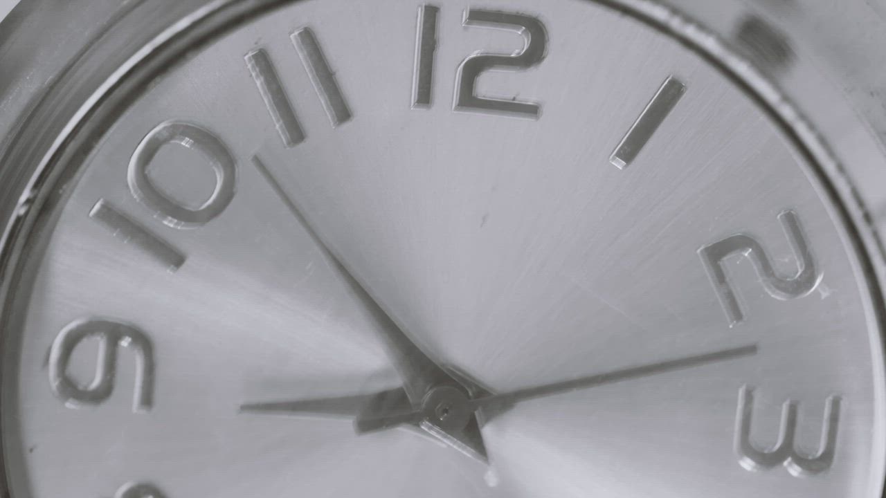 Metal analog clock moving fast in a close up shot - Free Stock Video