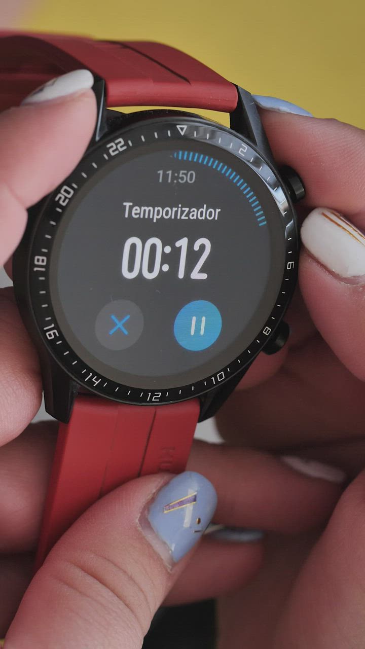 Smart watch with timer held by a woman - Free Stock Video