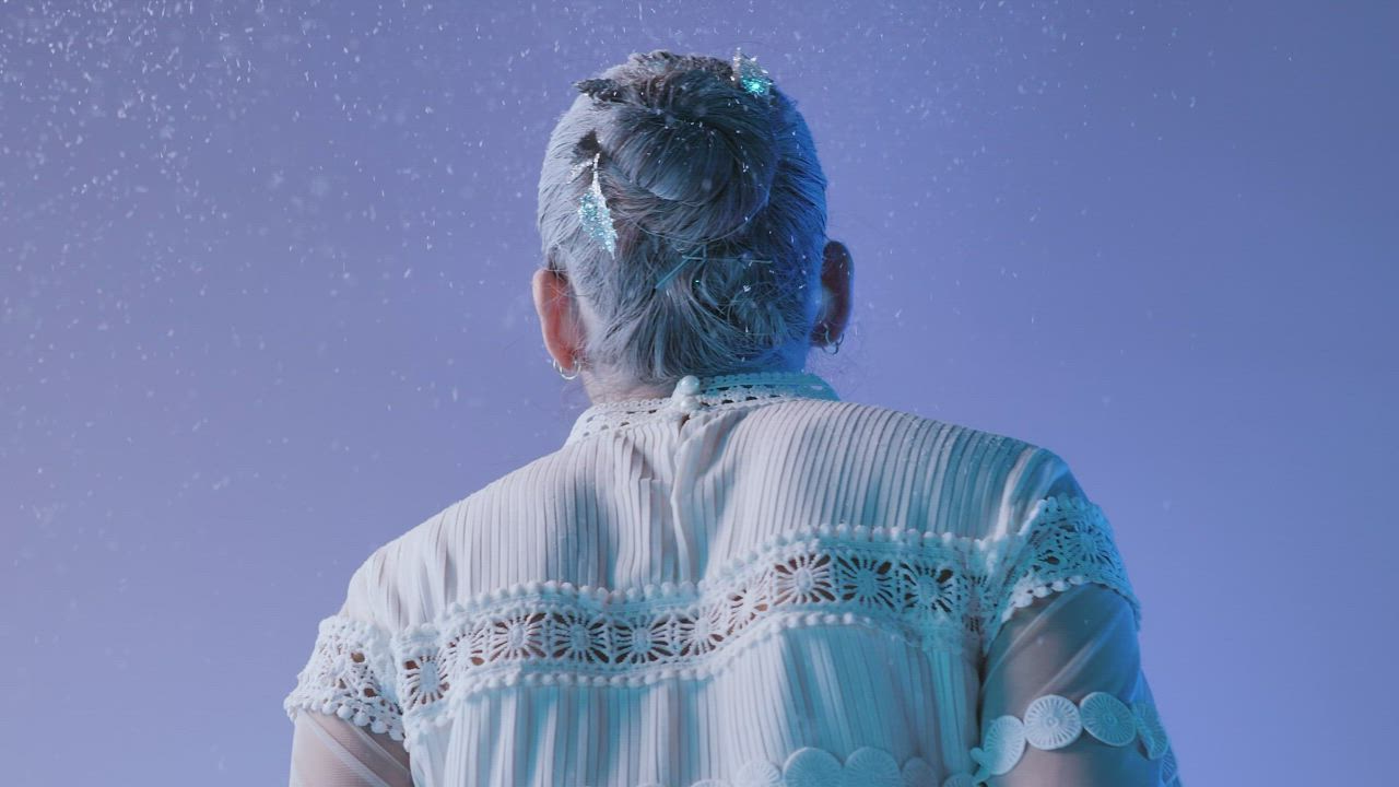 Young fashion model while snowing, low shot - Free Stock Video