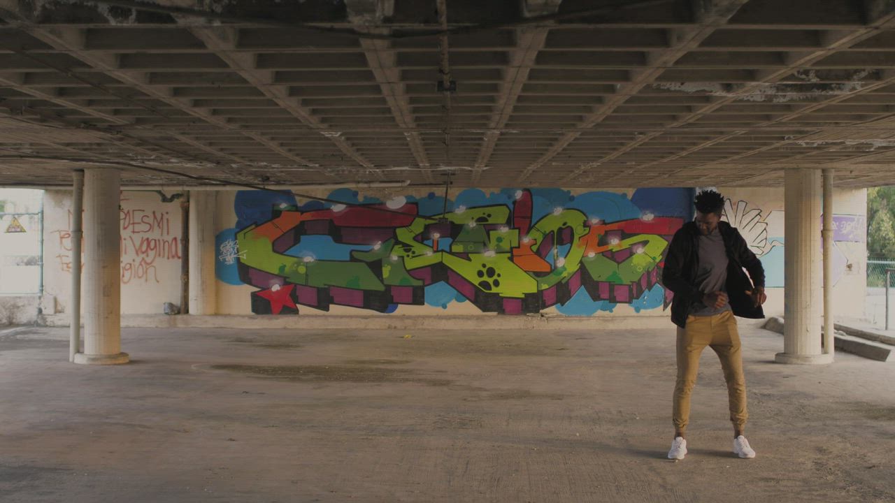 Urban man dancing at a parking building - Free Stock Video