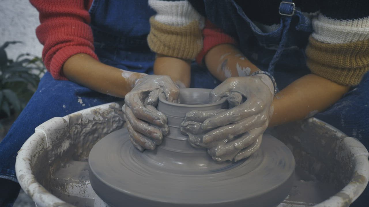 LGBTQ couple of girls making a clay vase together - Free Stock Video