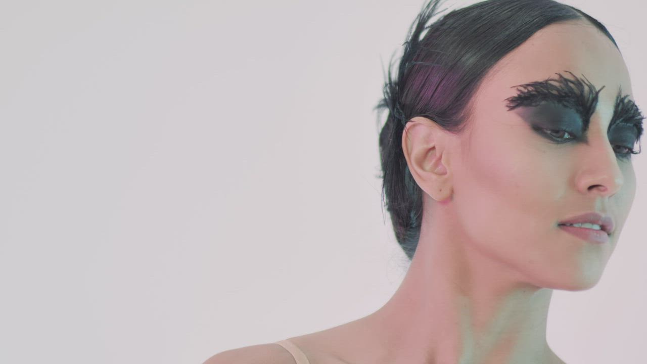 Portrait of a ballet dancer on a white background - Free Stock Video