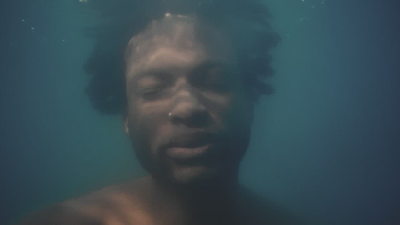 Face of a man submerged under water - Free Stock Video