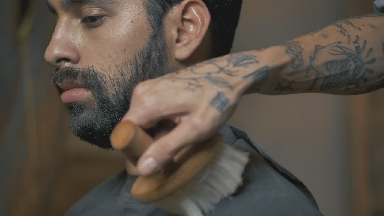 Finishing a haircut at a barbershop - Free Stock Video