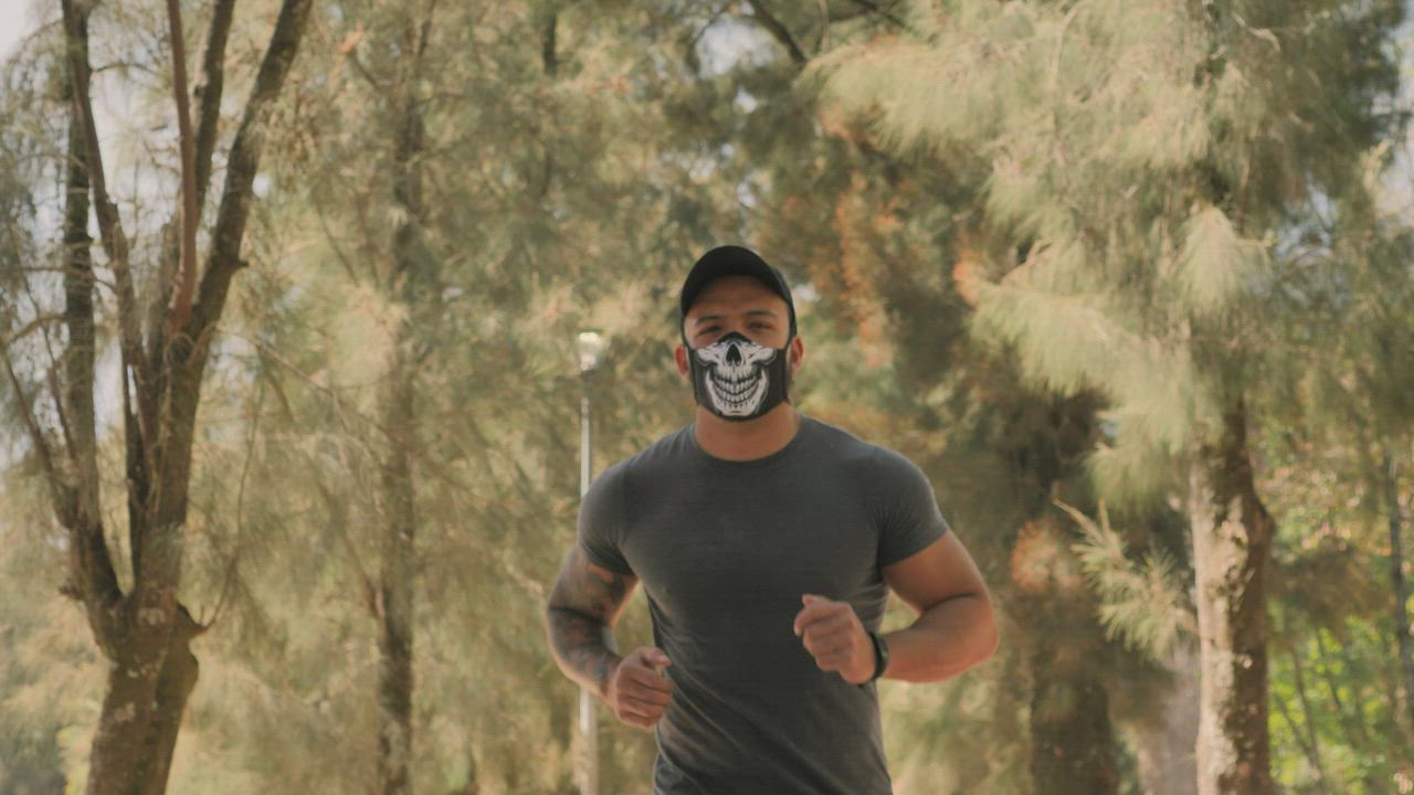 Man wearing face mask while jogging - Free Stock Video
