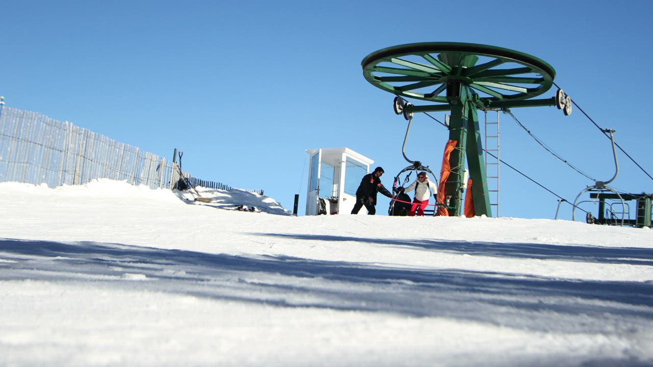 People getting off the ski lift - Free Stock Video