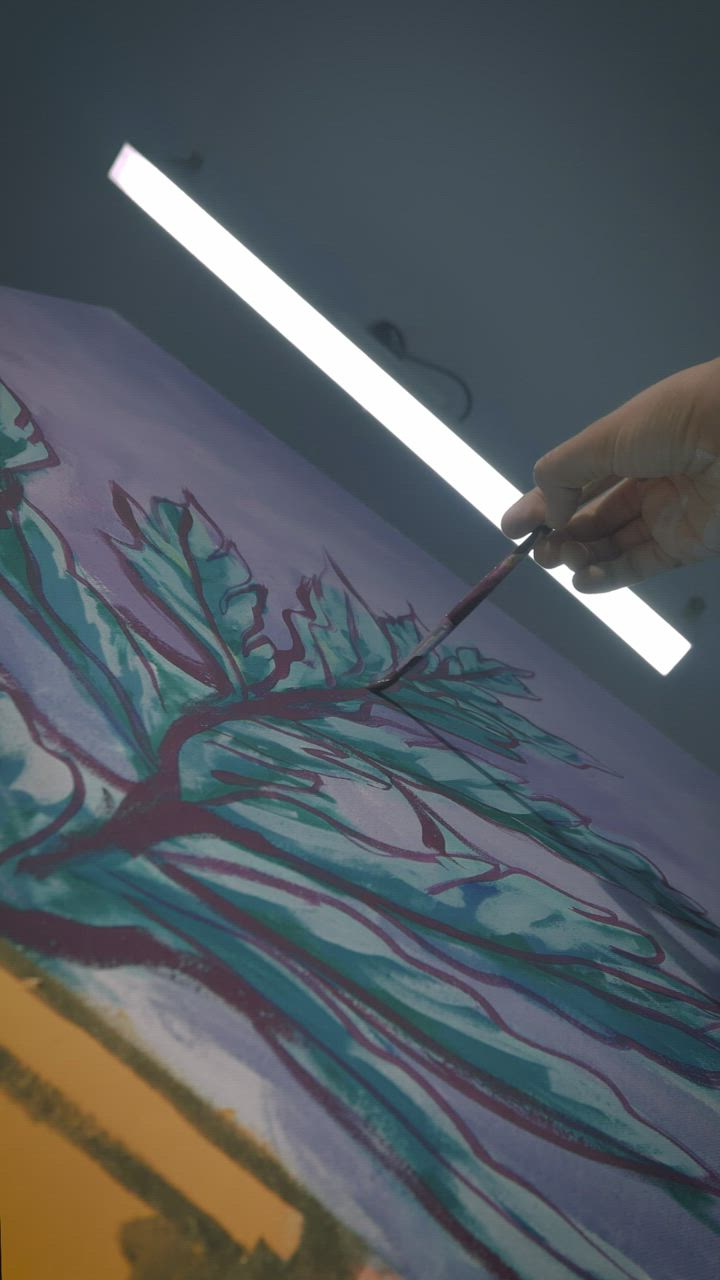 Low view of an artist painting on canvas - Free Stock Video