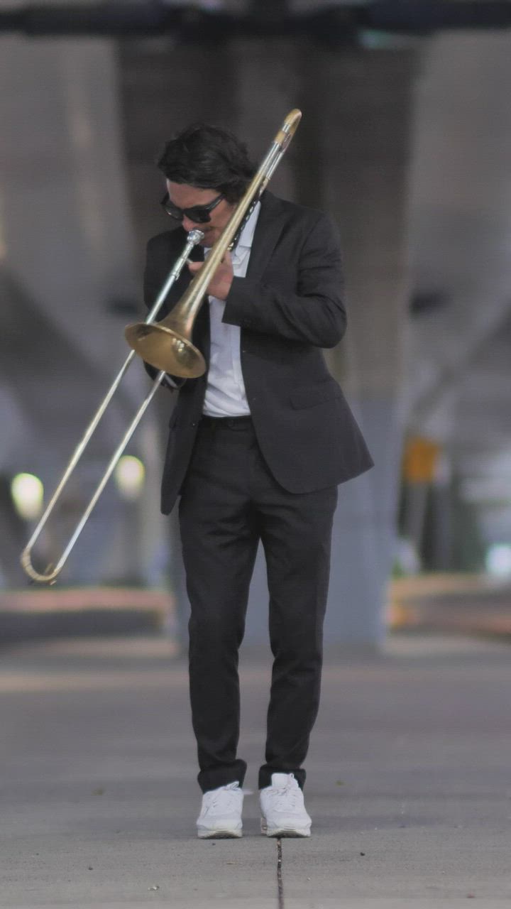 Musician dressed in black suit at the street - Free Stock Video