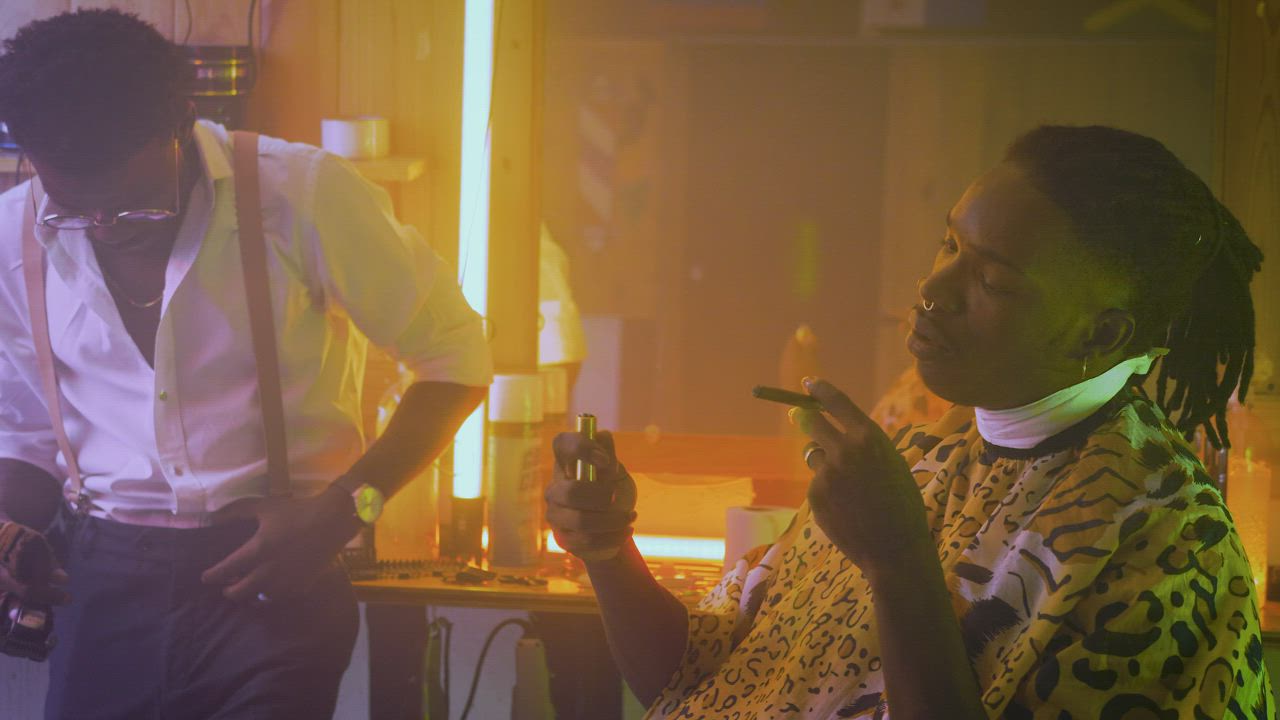 Client and barber smoking in barbershop - Free Stock Video