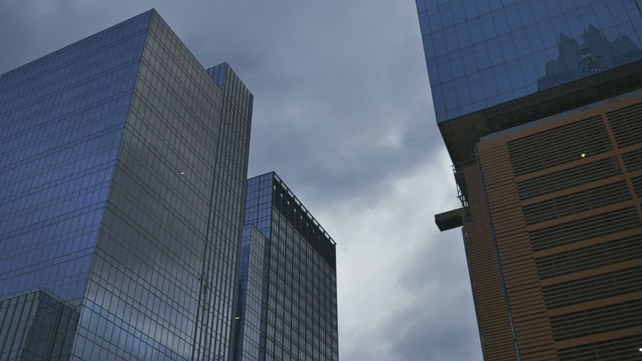 View to the tall buildings in the city from the ground - Free Stock Video