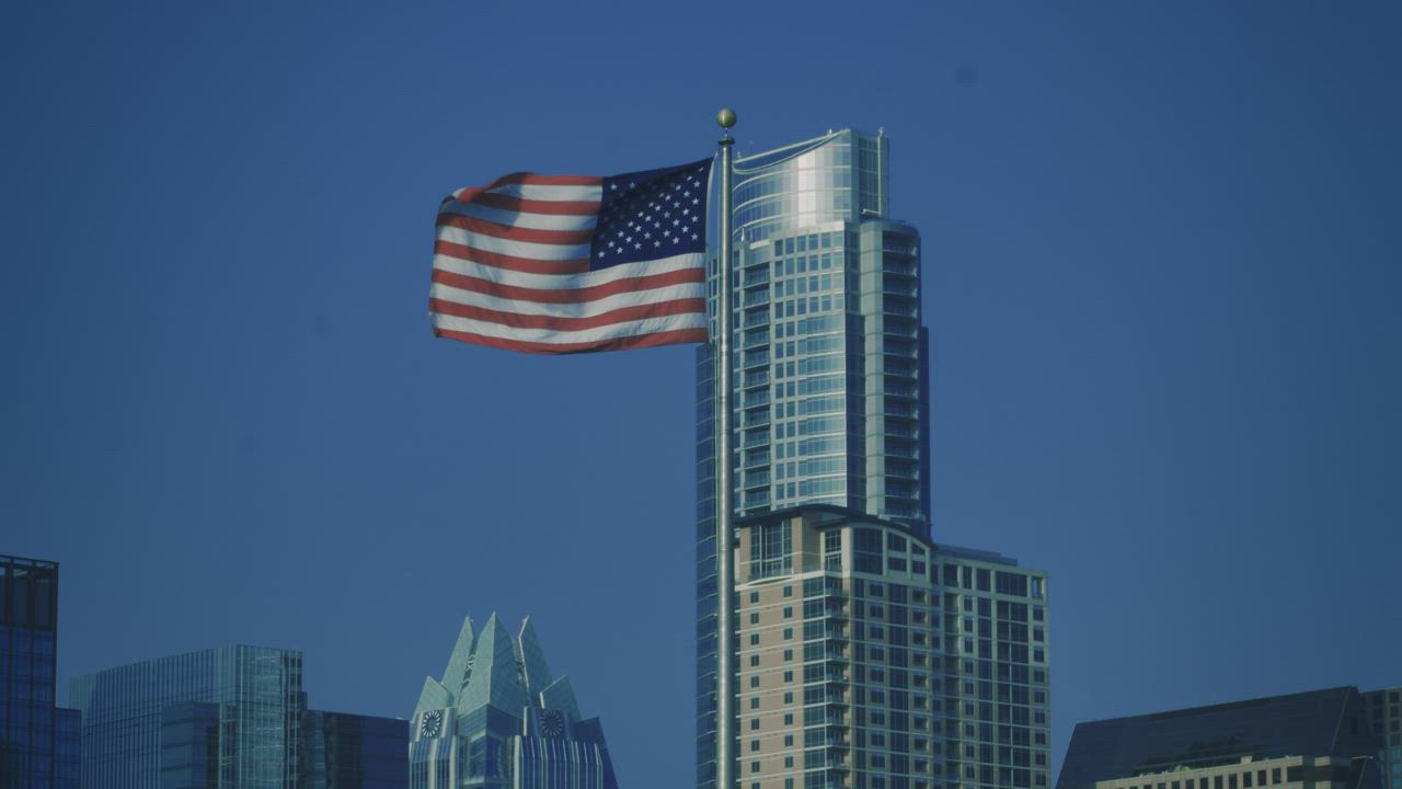 Flag of the United States waving on top of a flagpole - Free Stock Video