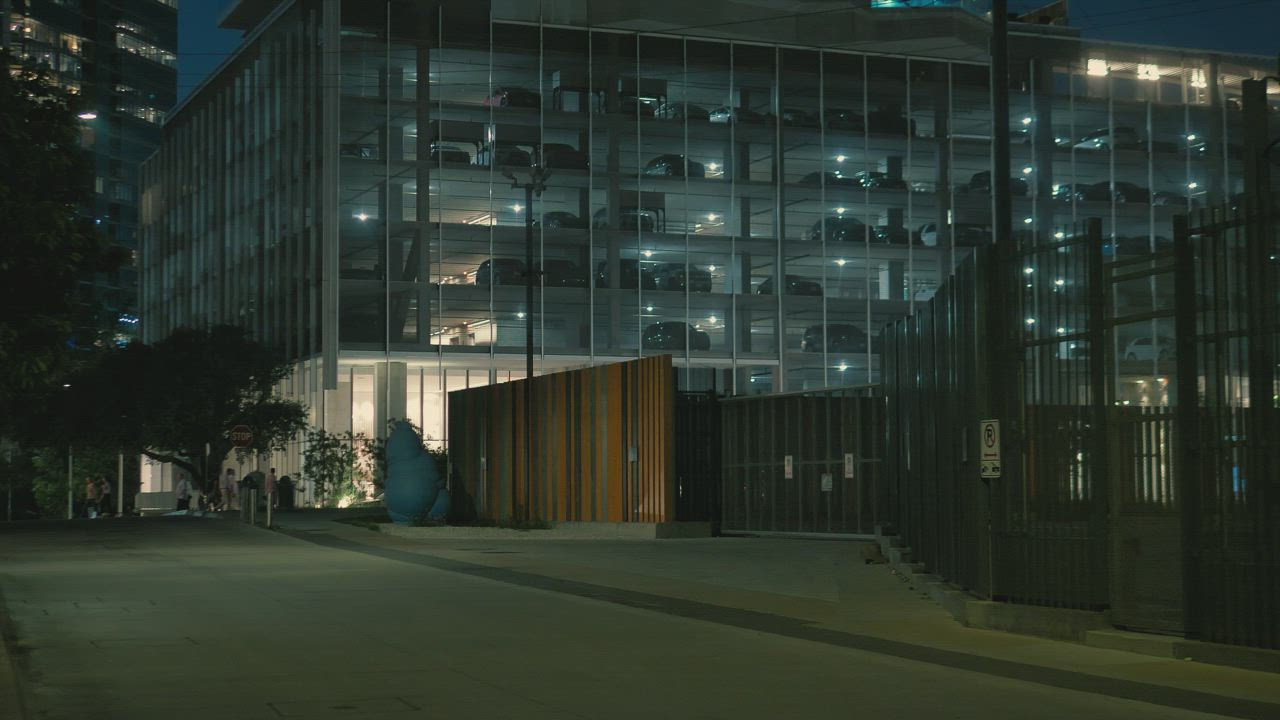 Building parking lot in the city at night - Free Stock Video