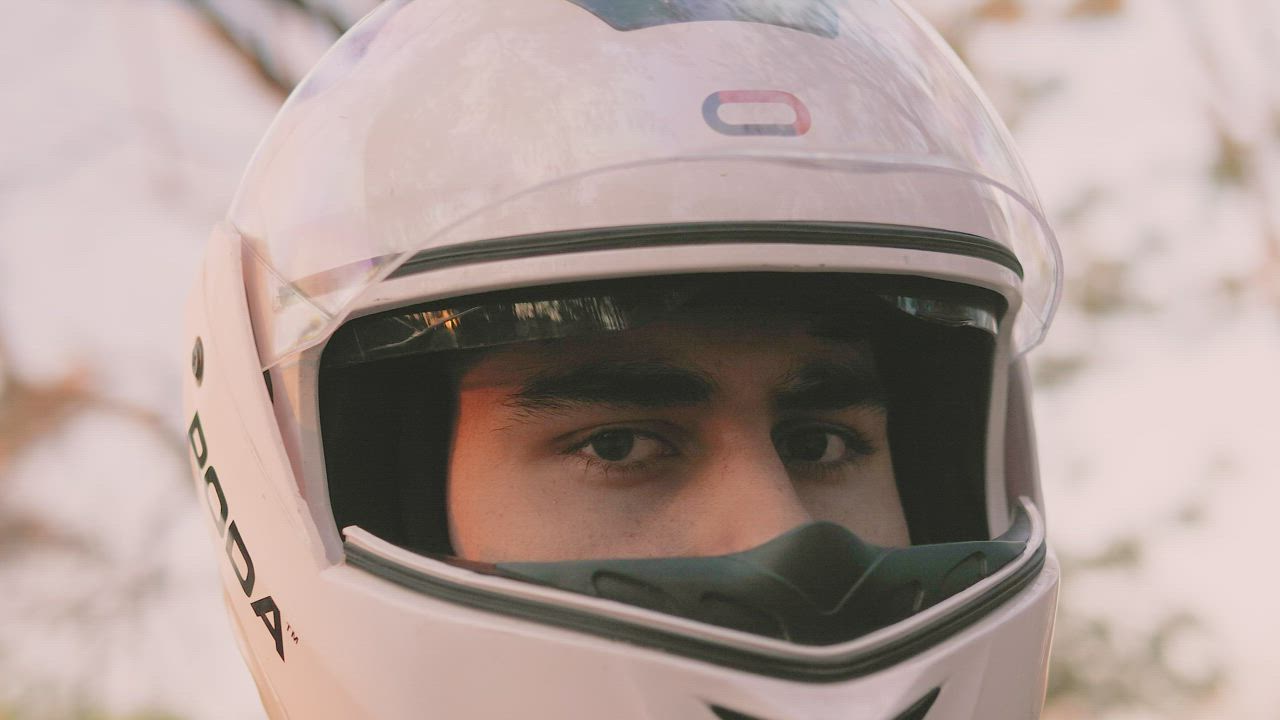 Face of a motorcycle rider with a helmet putting on the visor - Free ...
