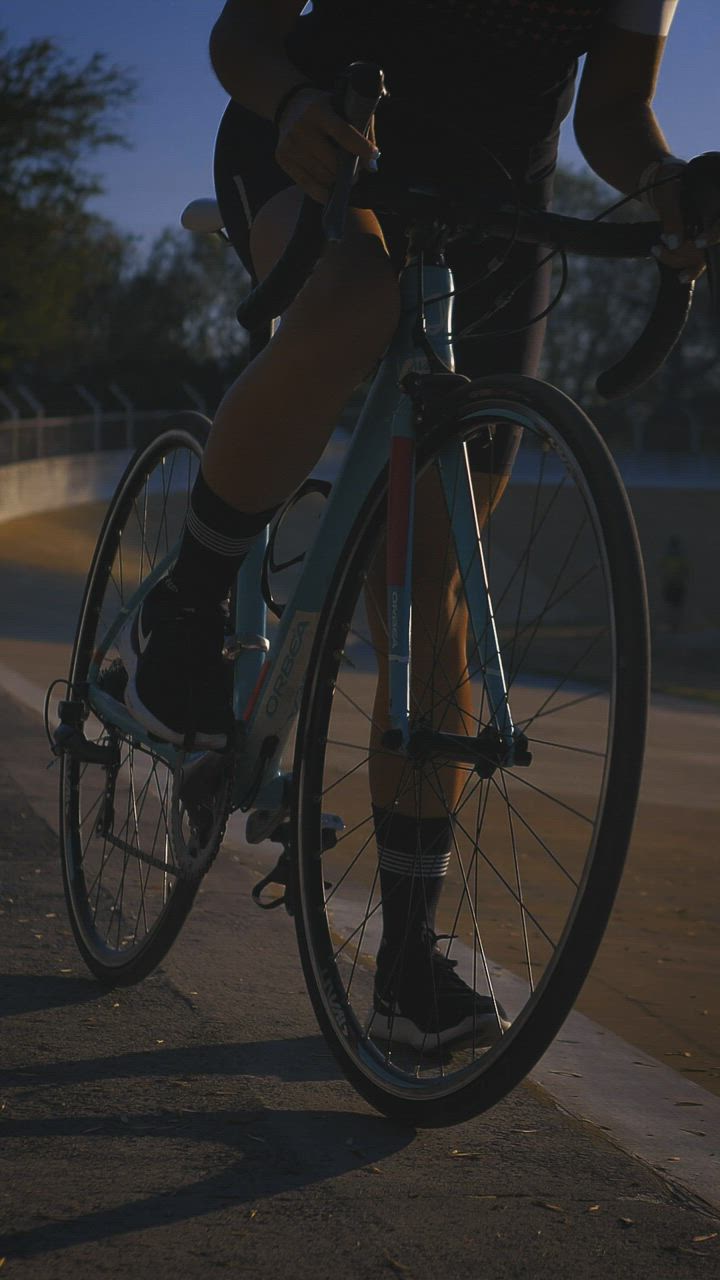 Person on a bicycle starts to ride on a cycling track - Free Stock Video