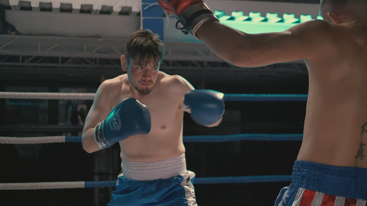Boxers hitting in a fight - Free Stock Video