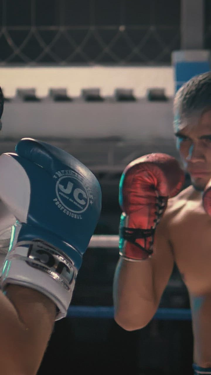 Two men on a ring fighting in a boxing match - Free Stock Video