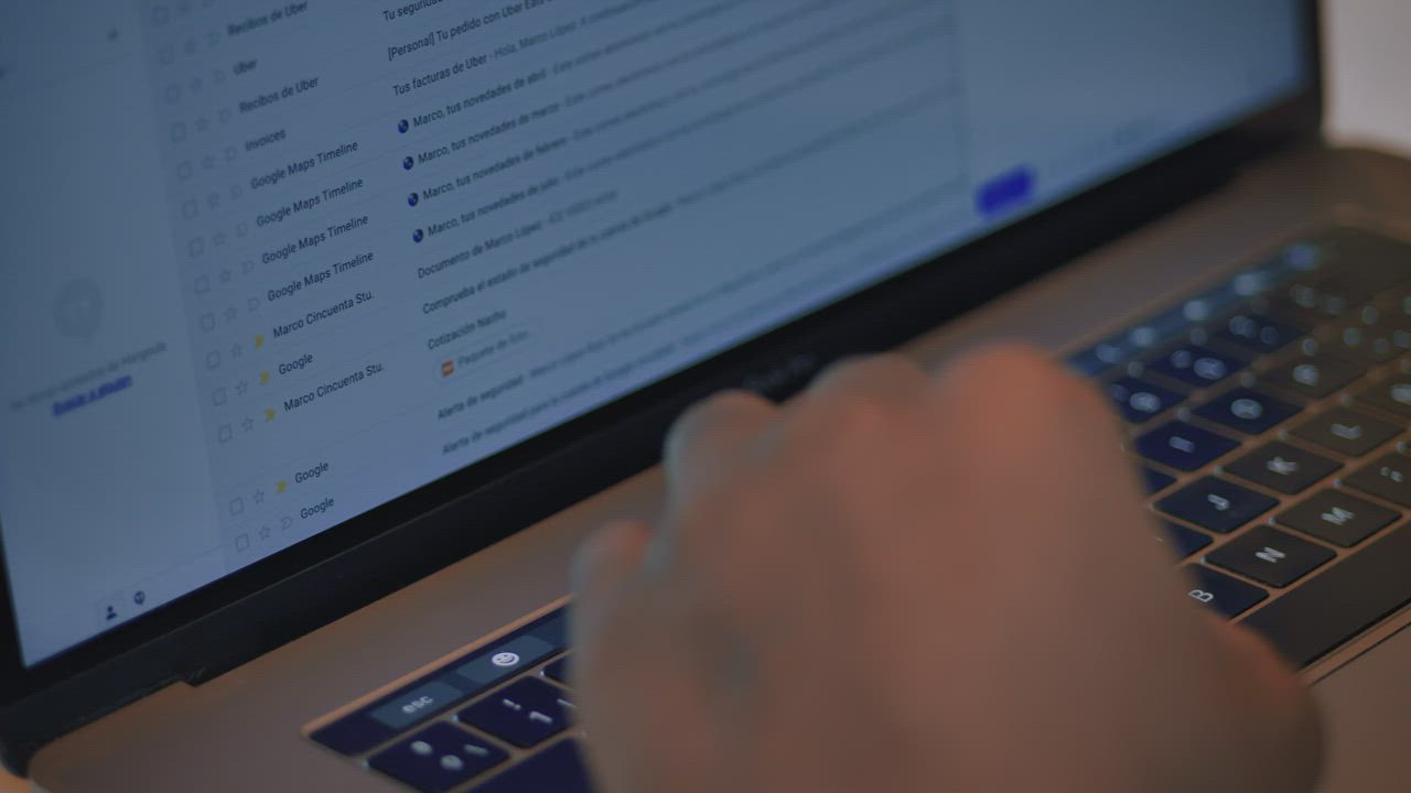 Hands typing on a Macbook Pro - Free Stock Video