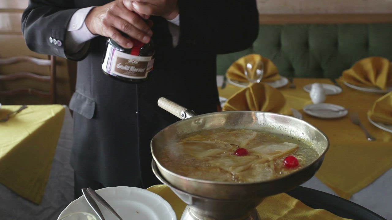 Chef in black suit cooking with fire - Free Stock Video