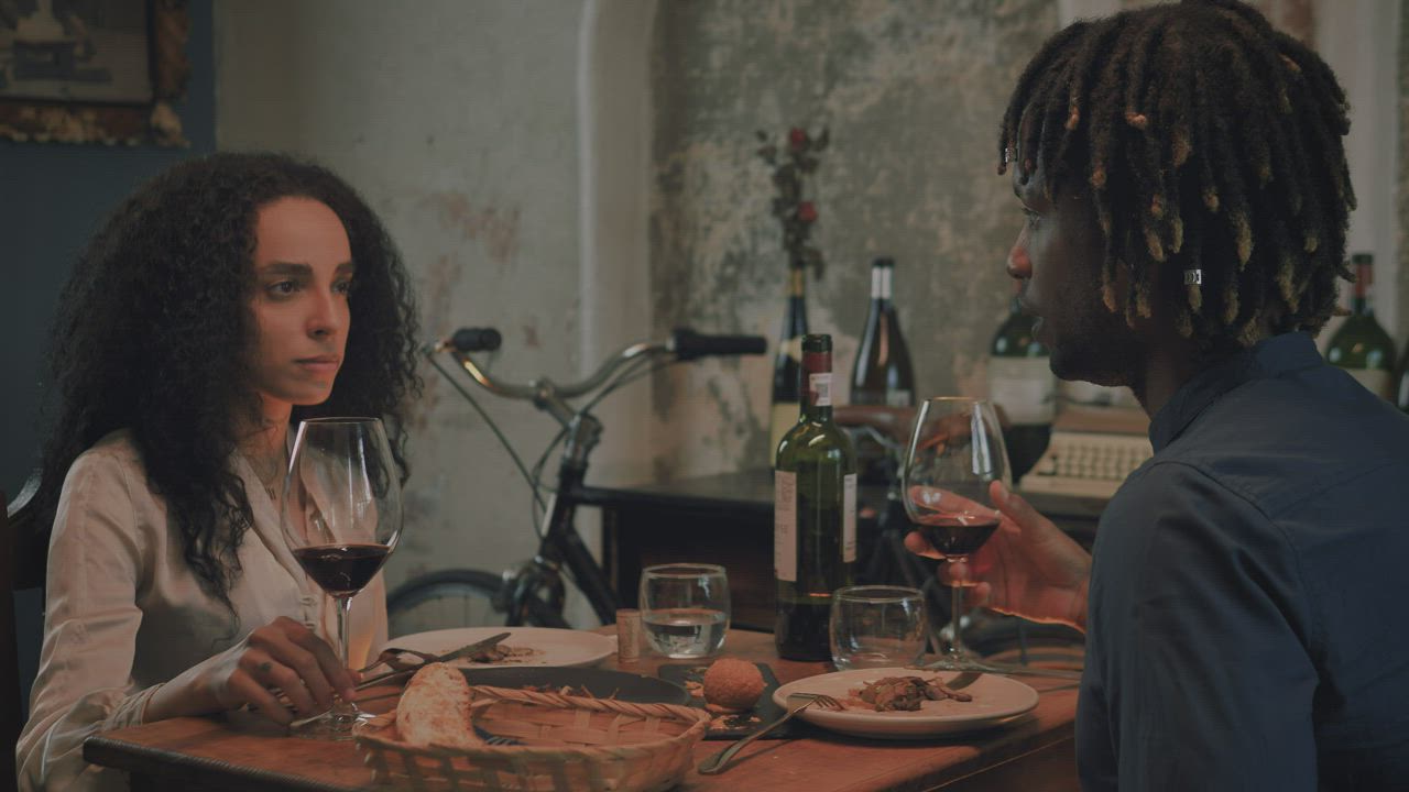 Romantic dinner of a boy and a girl with wine - Free Stock Video