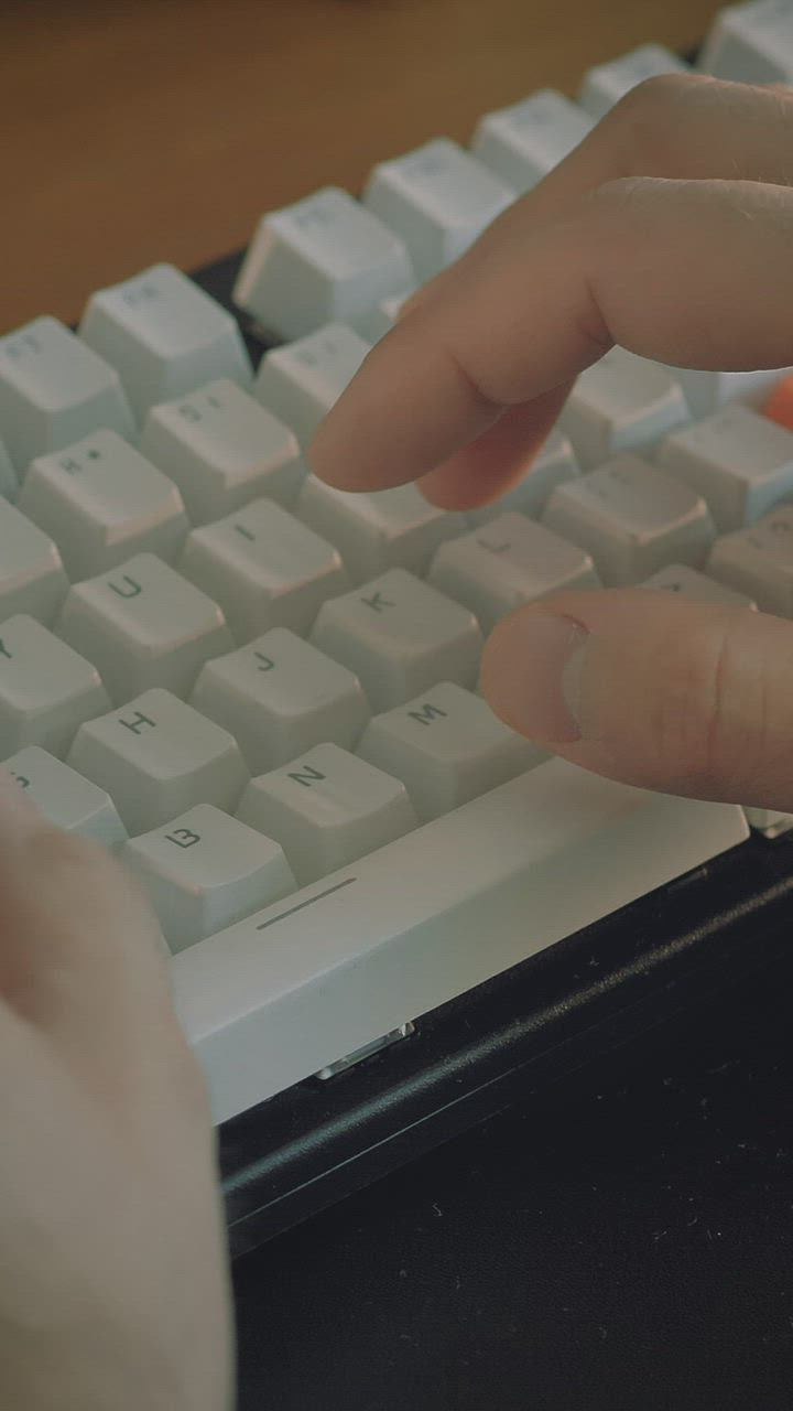 Hands of a person typing on a computer keyboard - Free Stock Video