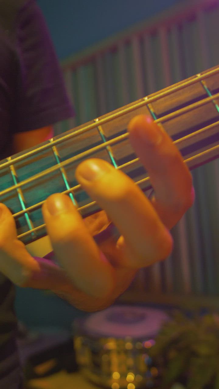 Hand of a man skillfully playing a bass - Free Stock Video