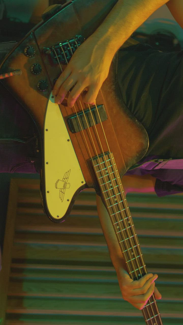 Bass player playing on top of a live stage - Free Stock Video