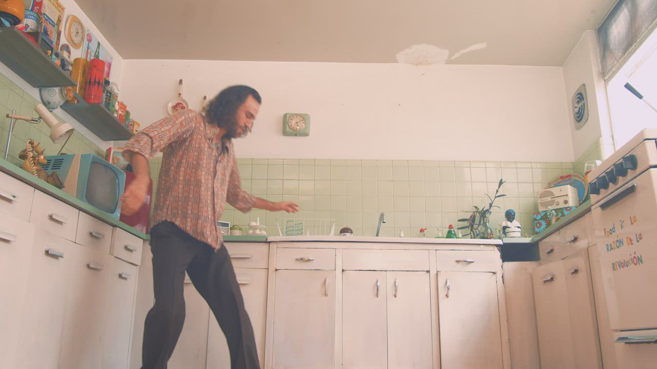 Man dancing in a retro kitchen - Free Stock Video