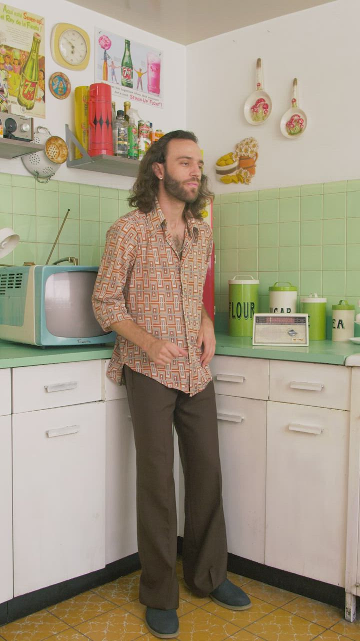 Man listening radio and dancing in the kitchen - Free Stock Video