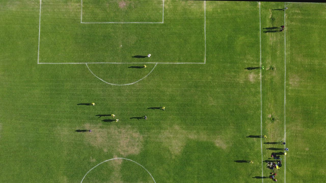 Soccer match on a grass court from above - Free Stock Video