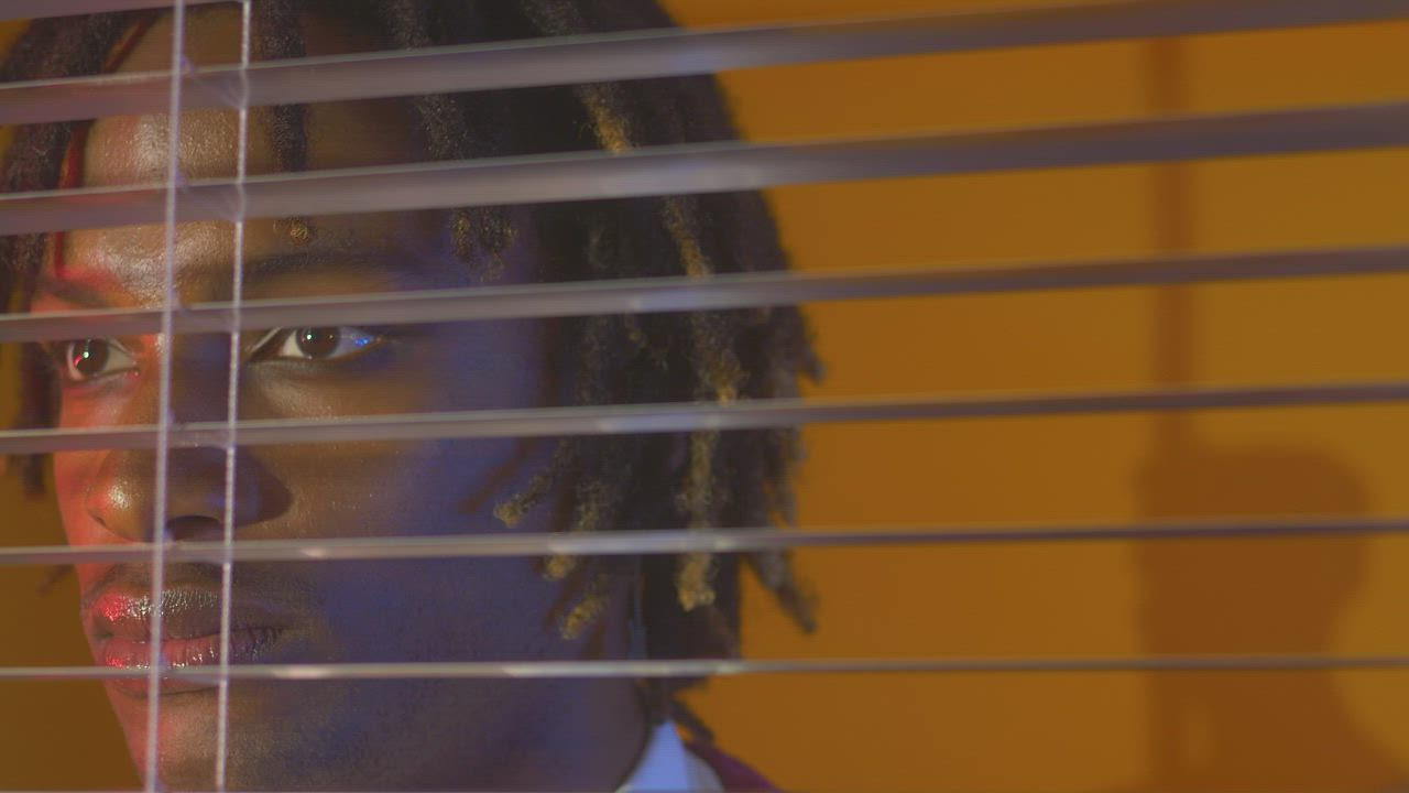 Taciturn face of a man through the window - Free Stock Video