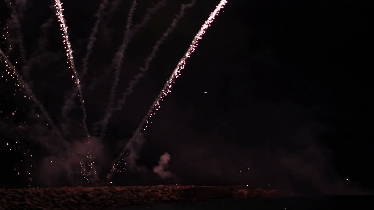 Fireworks rising from a pier - Free Stock Video