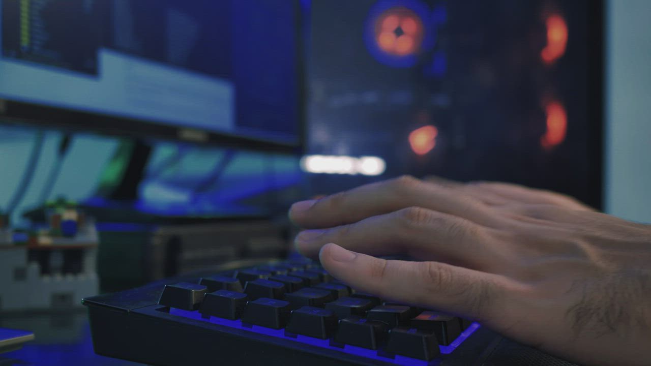 Hands of a programmer working on his computer - Free Stock Video