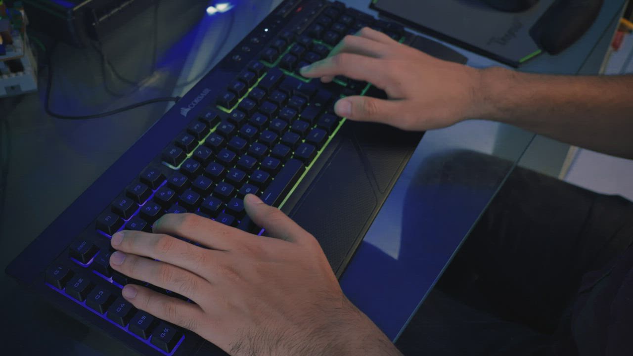 Expert programmer working at a workstation - Free Stock Video