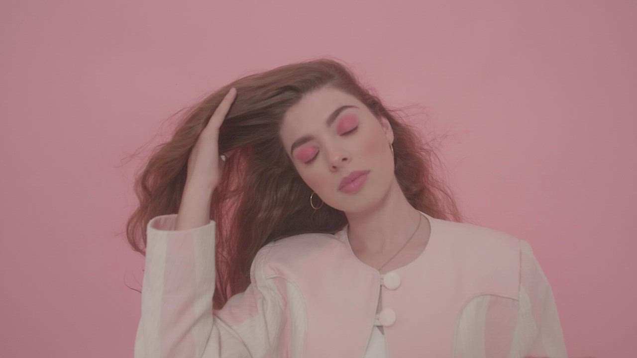 Fashion model on a pink background - Free Stock Video