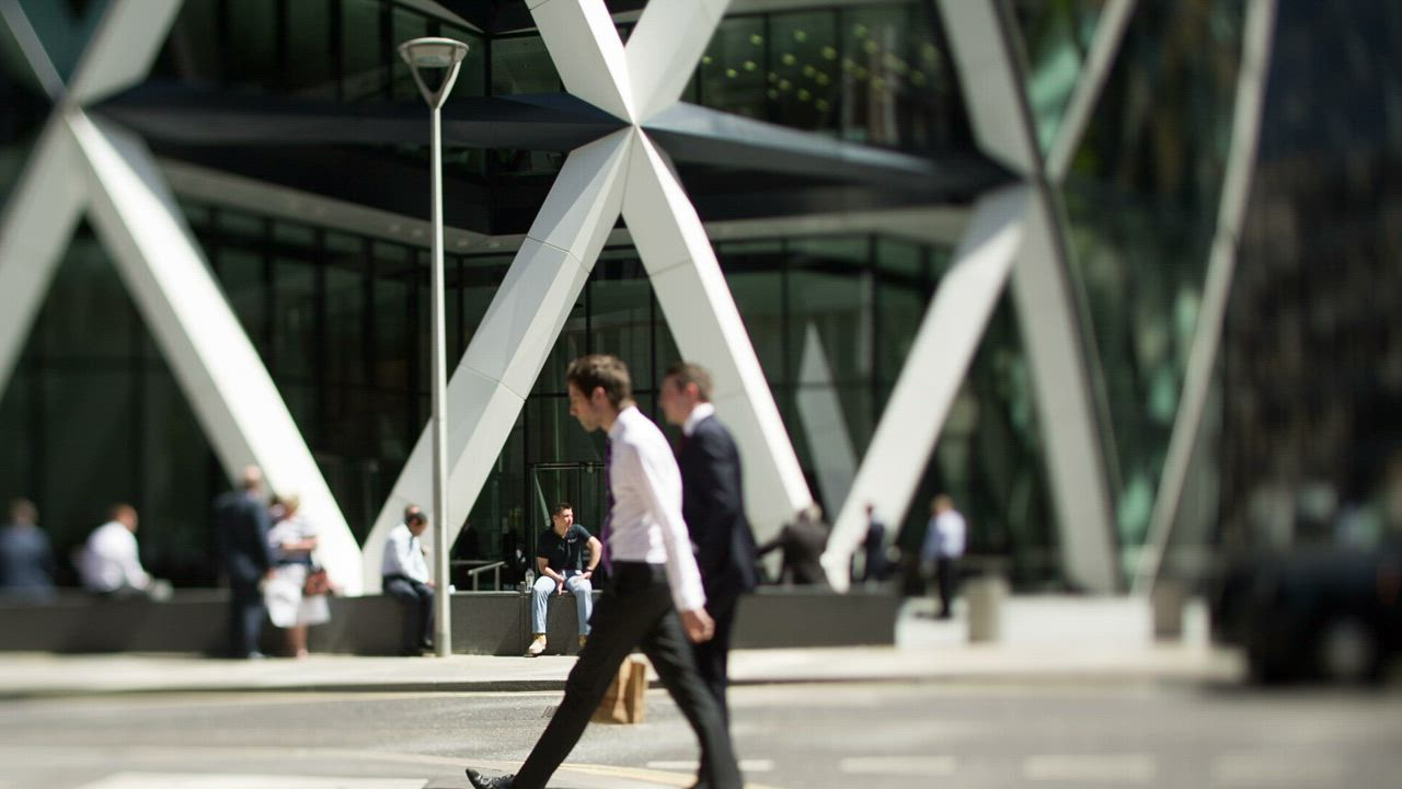 People walking in front of a building - Free Stock Video