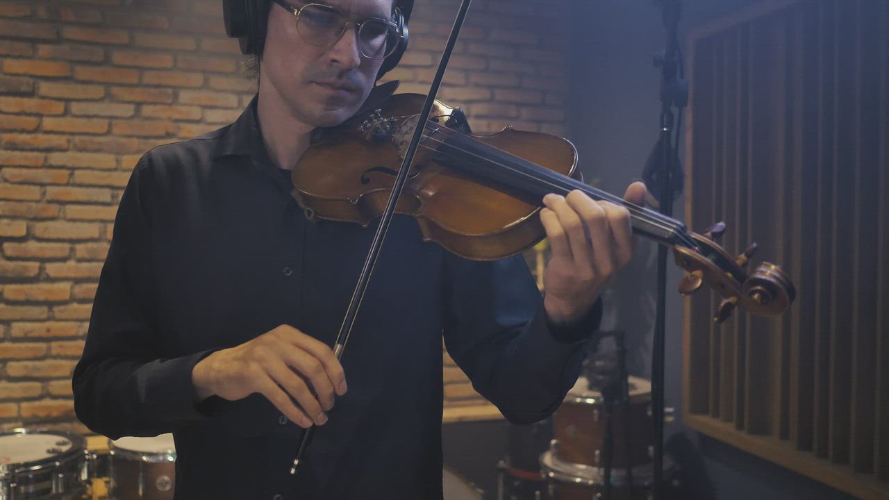 Male violinist recording in a studio - Free Stock Video