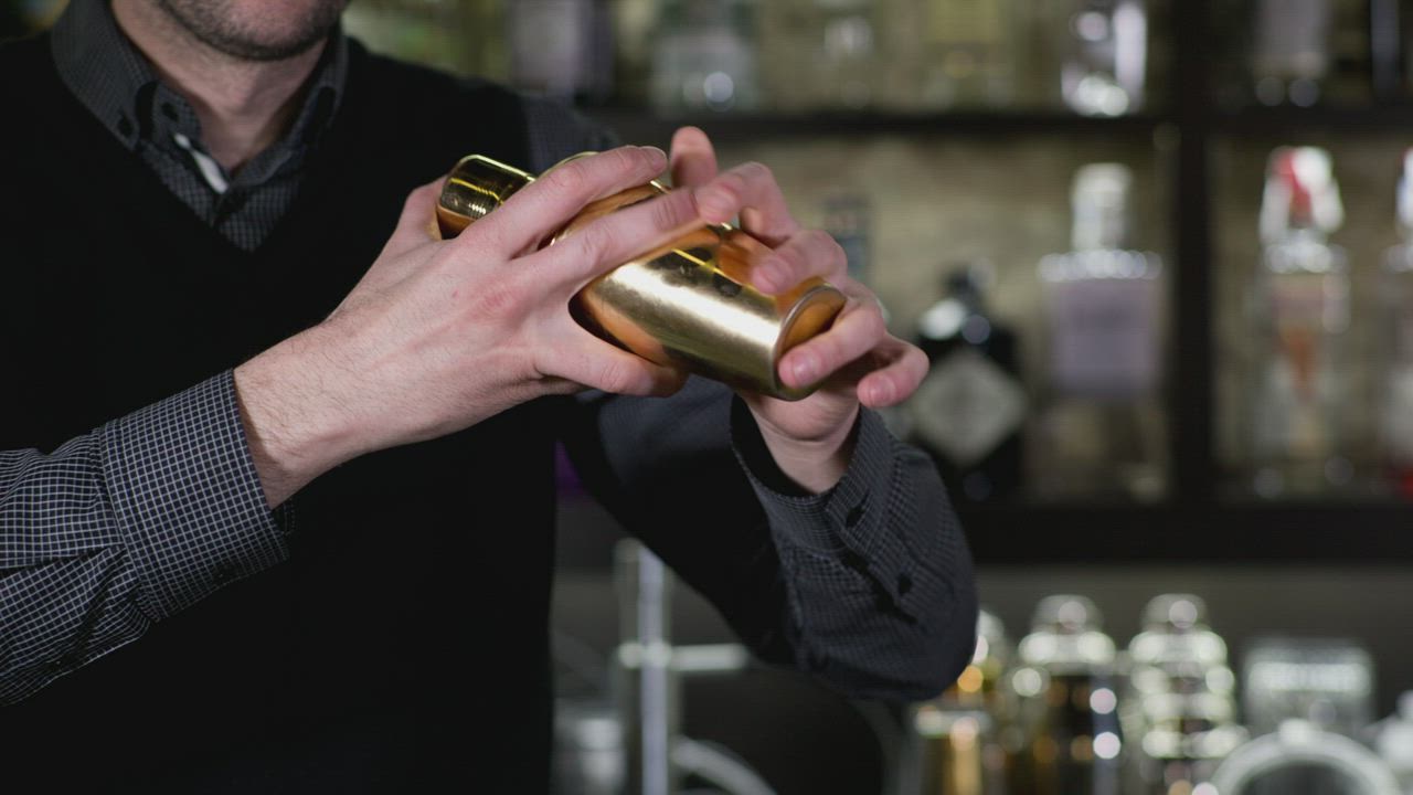Barista waving a cocktail shaker - Free Stock Video