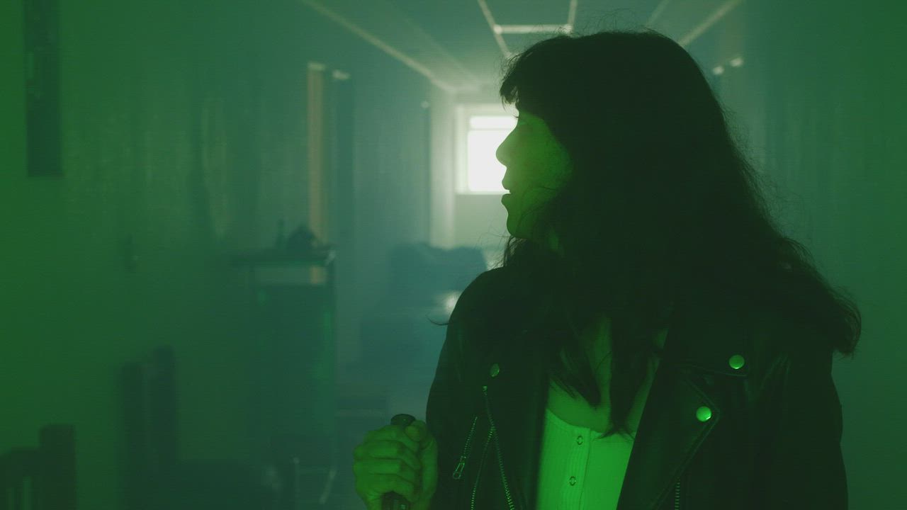 Scared woman in danger walking with a knife - Free Stock Video