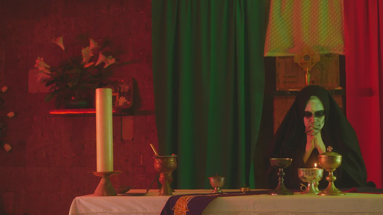 Terrifying ghost nun praying in a temple - Free Stock Video