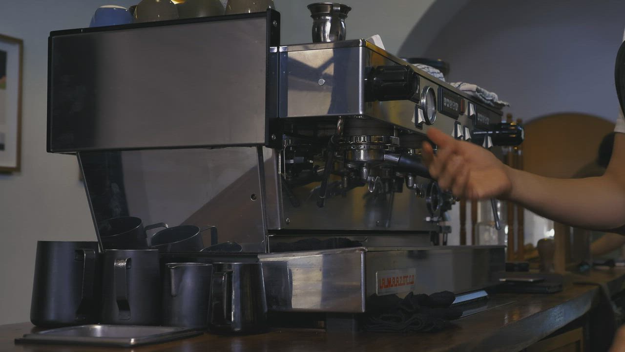 Operating a large coffee machine in a coffee shop - Free Stock Video