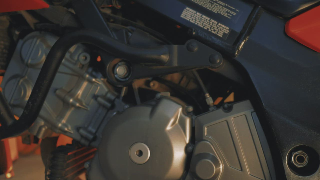 Close up shot of a motorcycle engine in a workshop - Free Stock Video