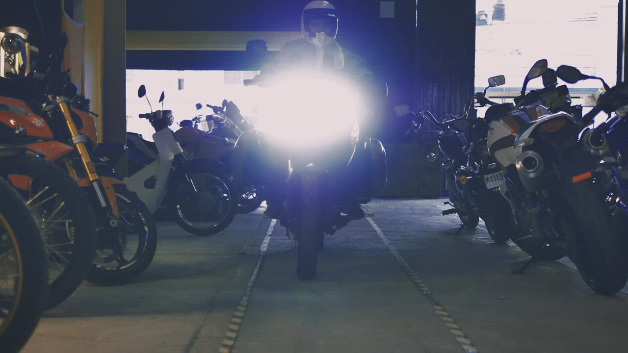 Arriving at a workshop full of motorcycles - Free Stock Video