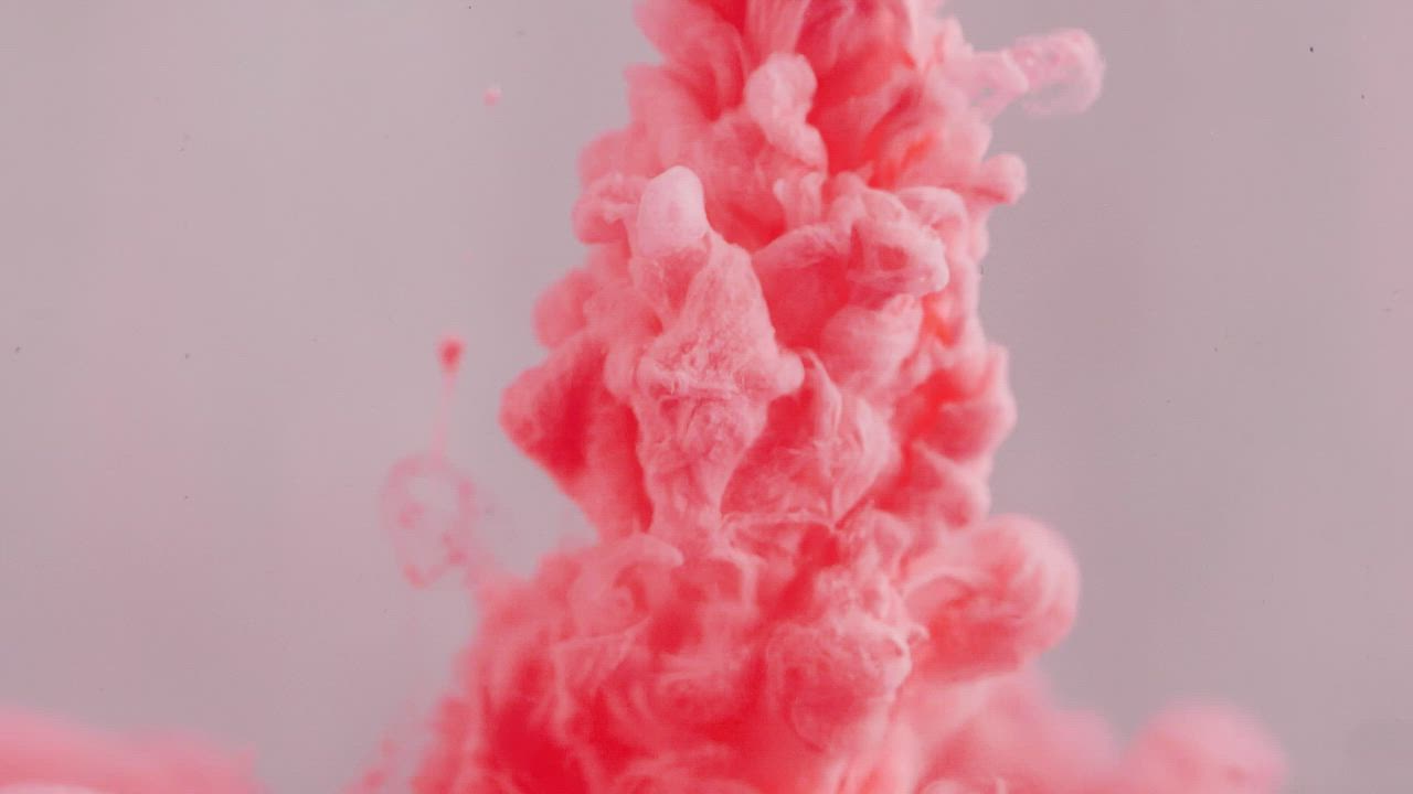 Pink ink cloud entering water - Free Stock Video